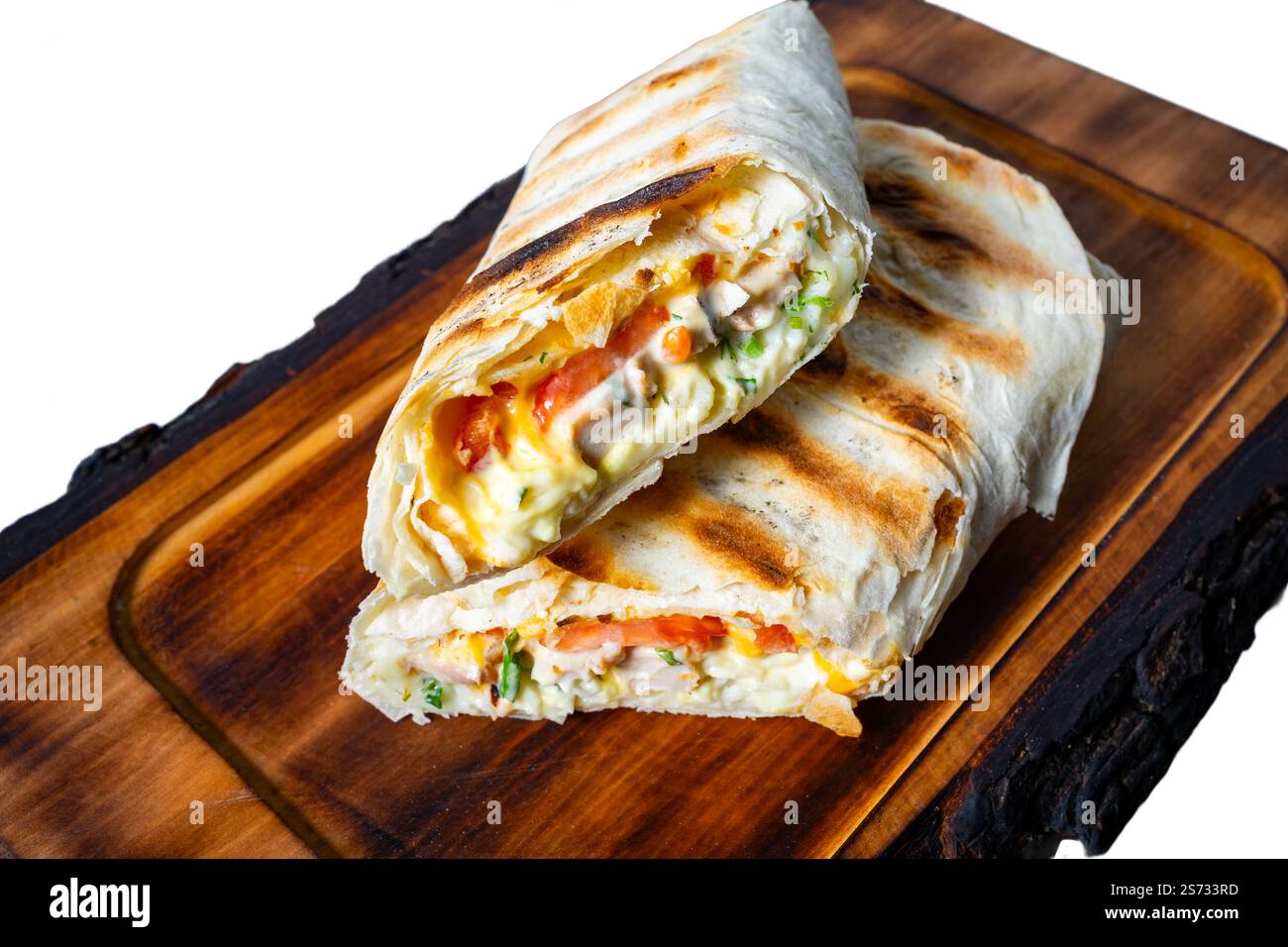 Two grilled wraps filled with chicken, fresh vegetables, and melted ...