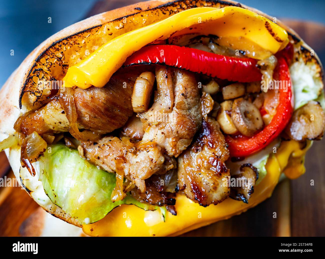 A mouthwatering grilled sandwich packed with seasoned meat, melted ...