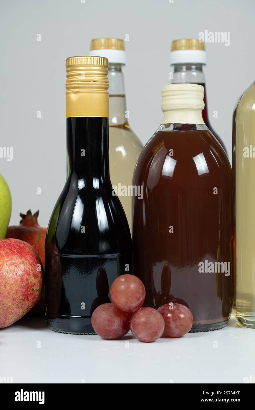 Different types of vinegar. Balsamic, pomegranate and apple vinegars in ...
