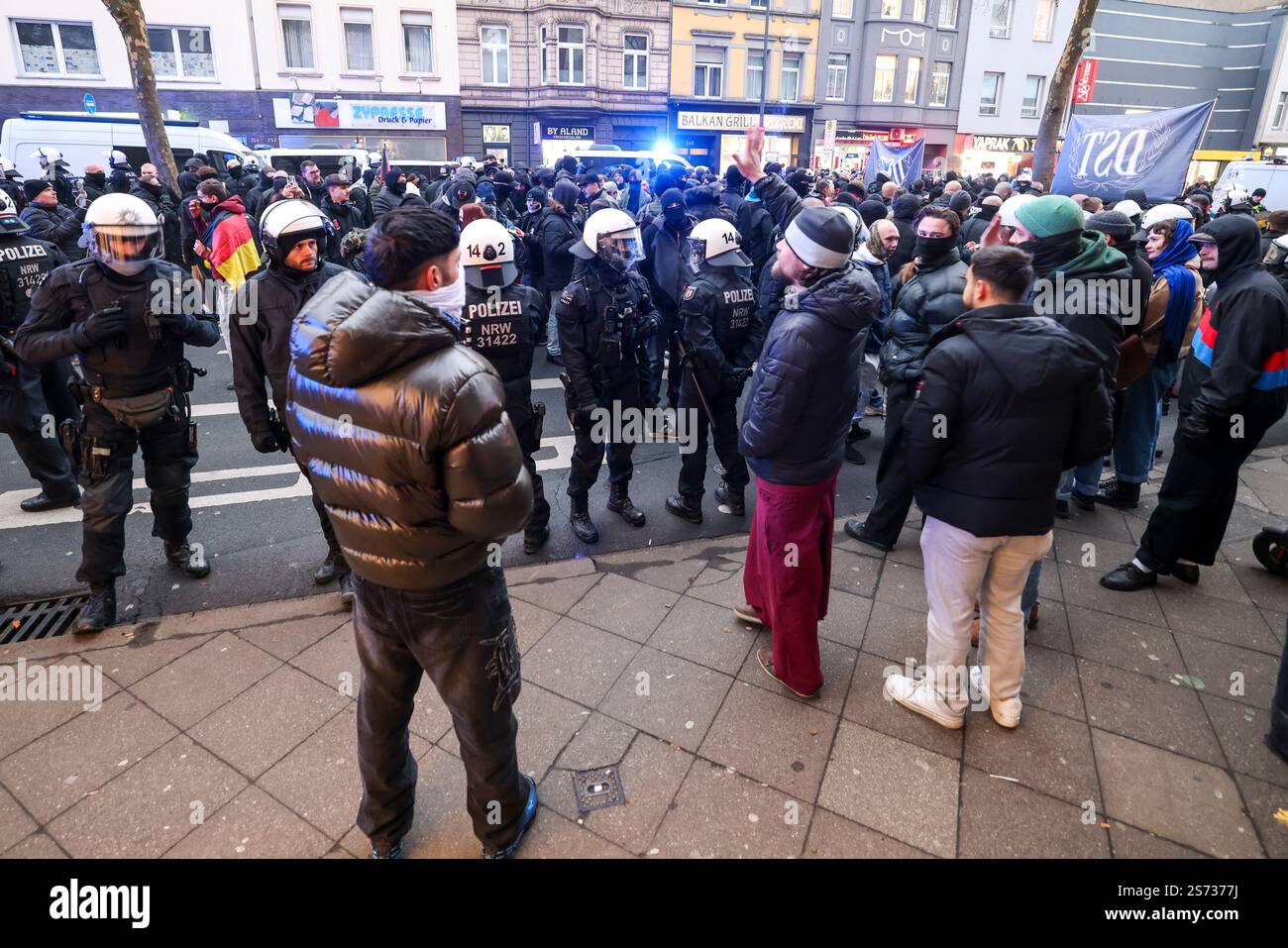 Aachen, Germany. 18th Jan, 2025. Police officers separate the two ...