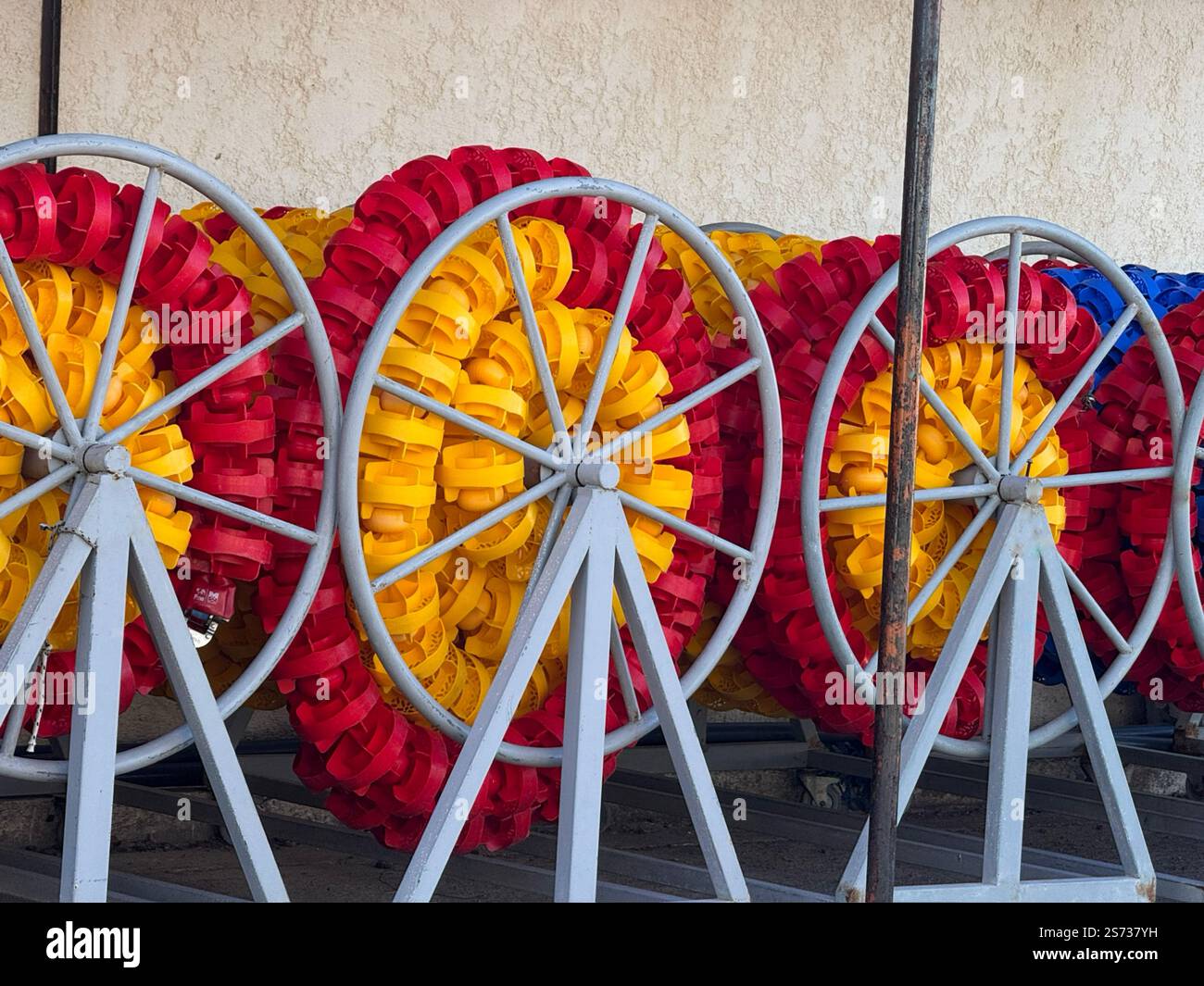 Swimming pool race tracks in lane line storage reels outside the fifty ...