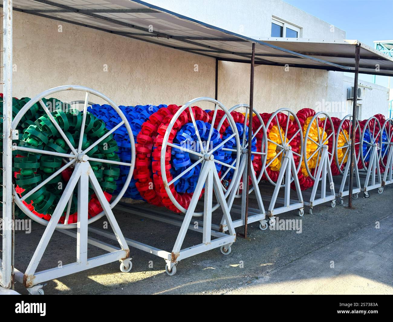 Swimming pool race tracks in lane line storage reels outside the fifty ...