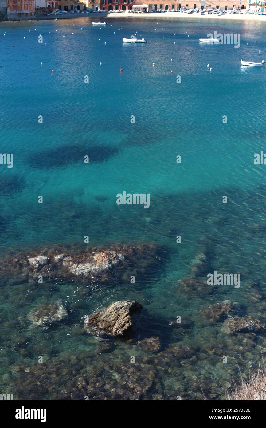 Water of azure sea and stones. Sunny weather. Vacation in Liguria ...
