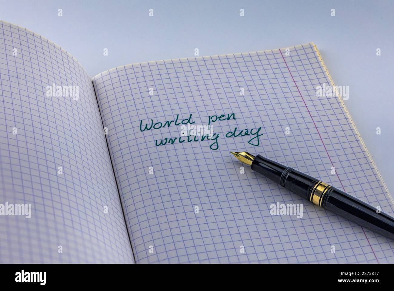 International ink pen writing day, pen on white background in man's ...