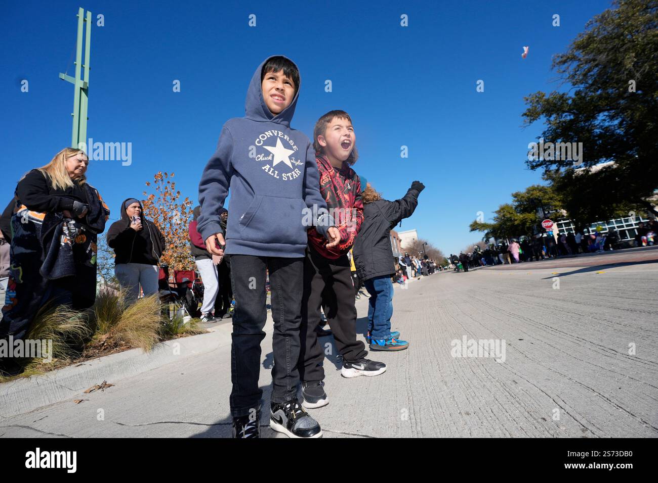 Axel Flores, 9, center left, and Brandon Roth, 8, center right, watch ...