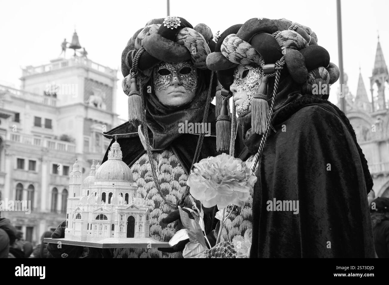 Two masks in turbans at St Mark's Square during traditional Carnival ...