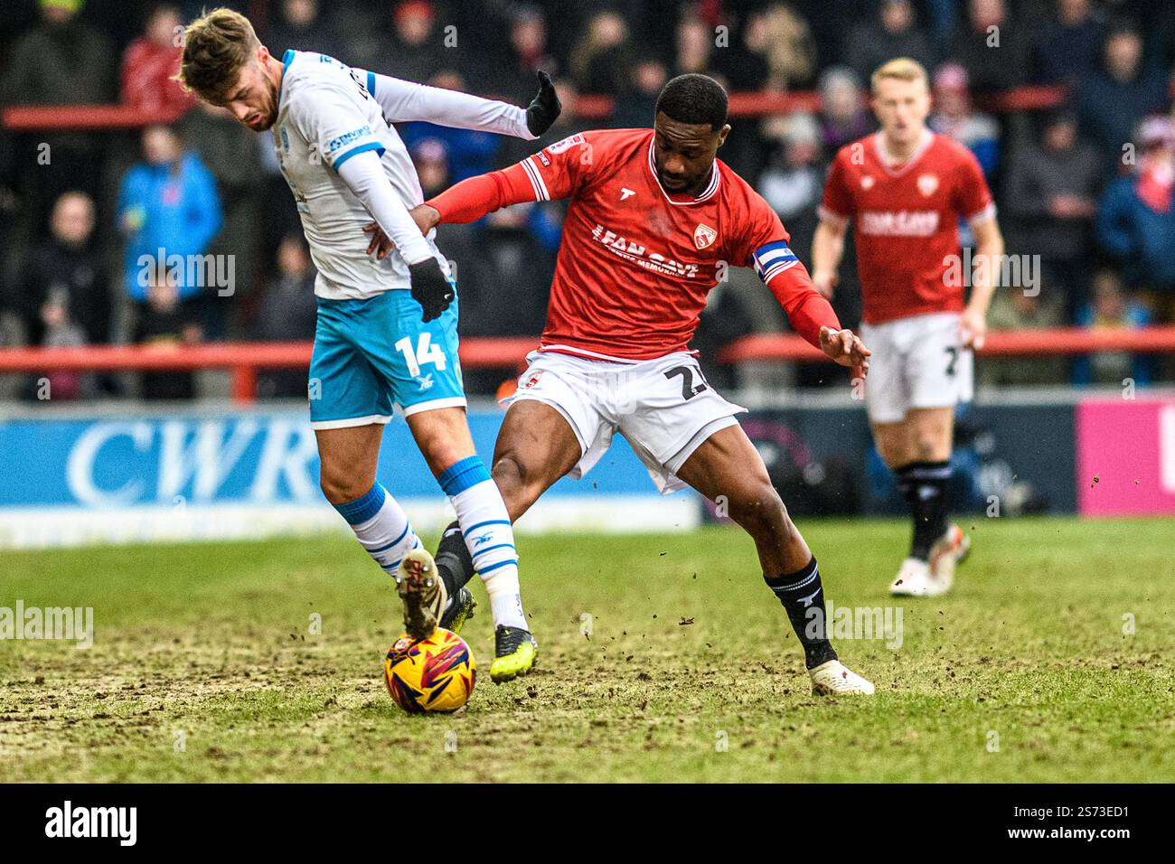 Morecambe FC's Yann Songo'o tackles Jack Lankester of Crewe Alexandra ...