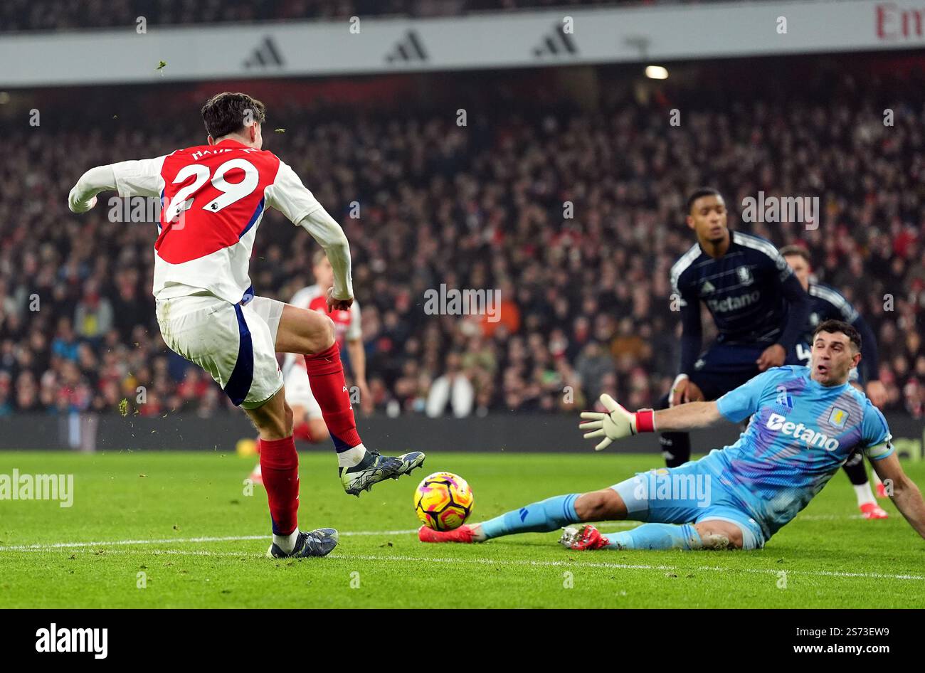 Aston Villa goalkeeper Emiliano Martinez saves from Arsenal's Kai ...