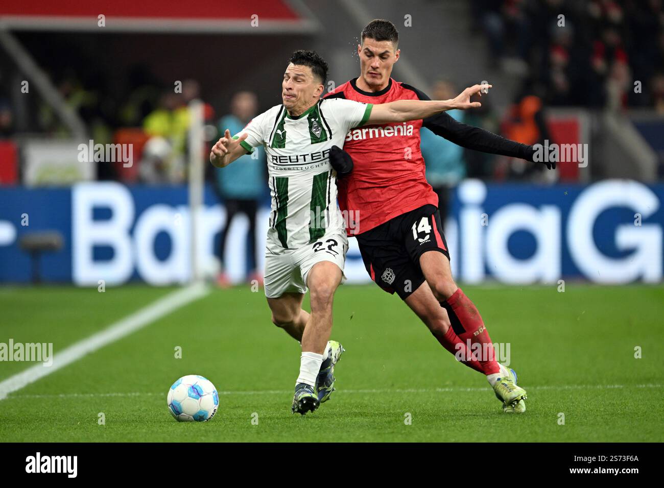 Leverkusen's Patrik Schick, right, and Gladbach's Stefan Lainer fight ...