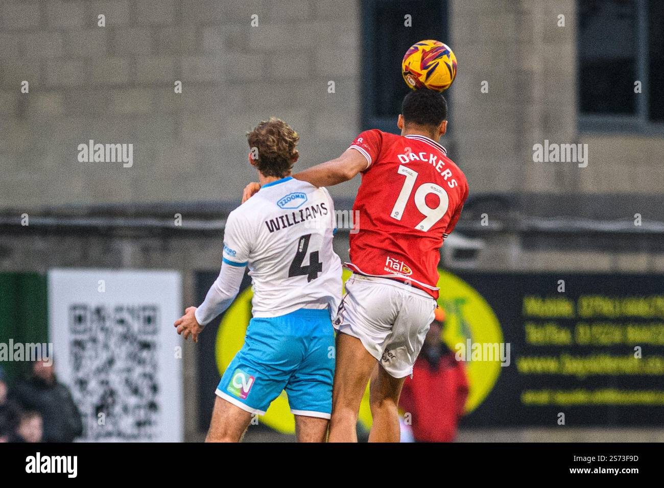 Morecambe FC's Marcus Dackers beats Zac Williams of Crewe Alexandra FC ...