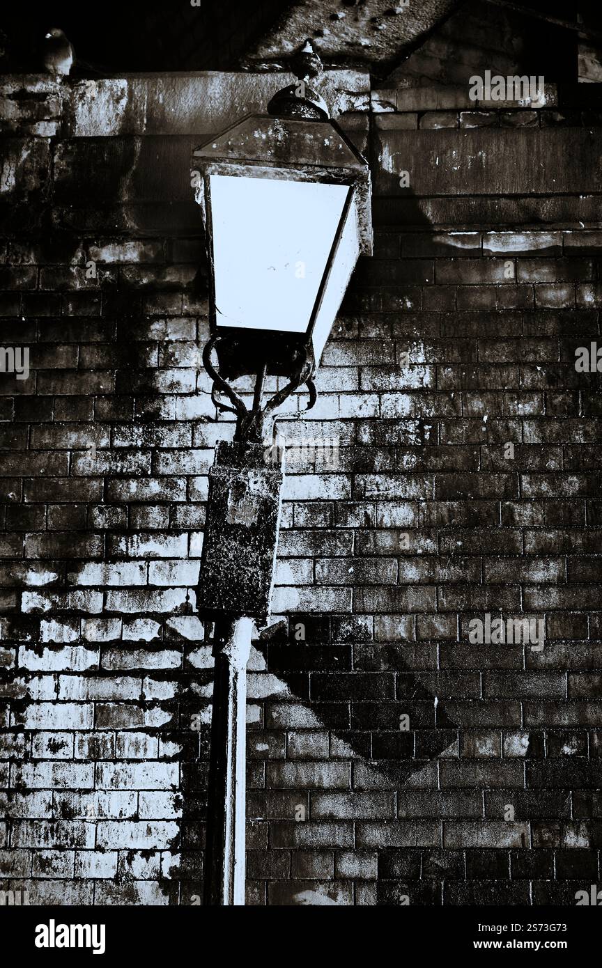 Victorian style lamp post illuminating dark dank tunnel Stock Photo - Alamy