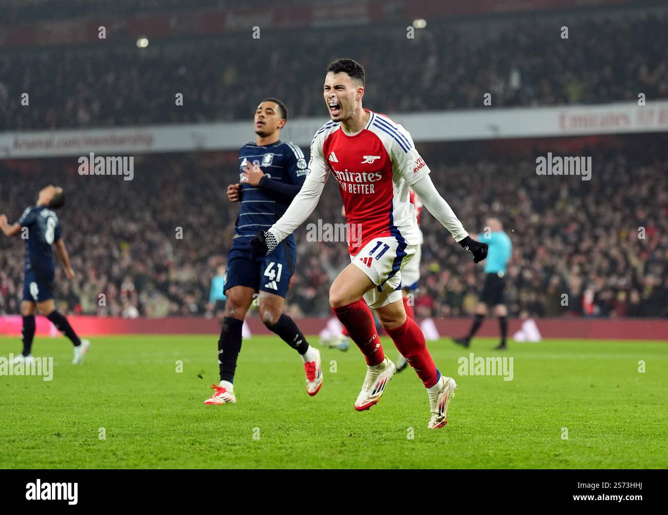 Arsenal's Gabriel Martinelli celebrates scoring their side's first goal ...