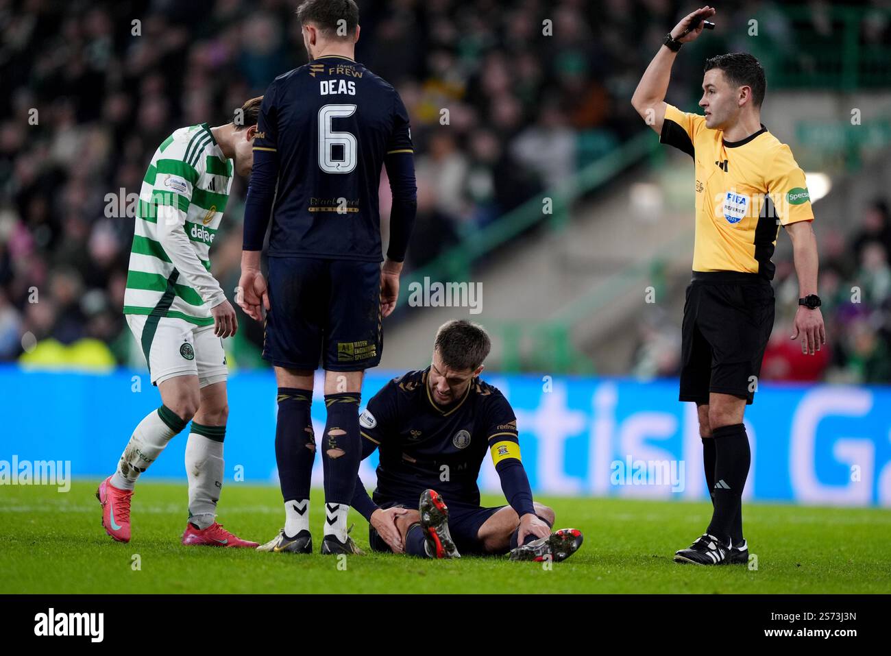 Kilmarnock's Brad Lyons sits on the pitch before going off with an ...