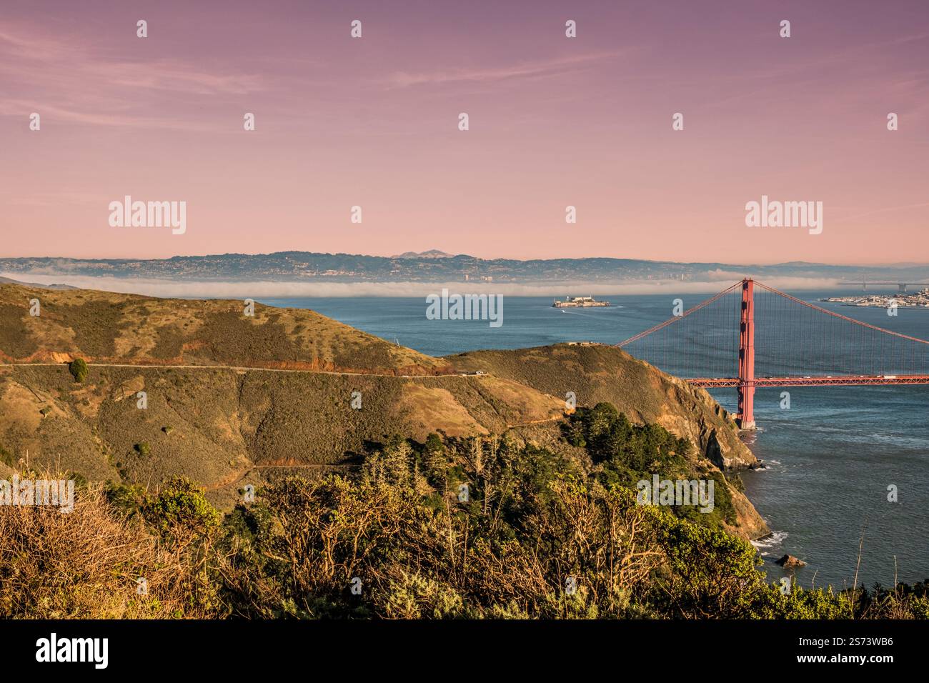 The golden gate bridge with the Alcatraz Island Prison in the ...