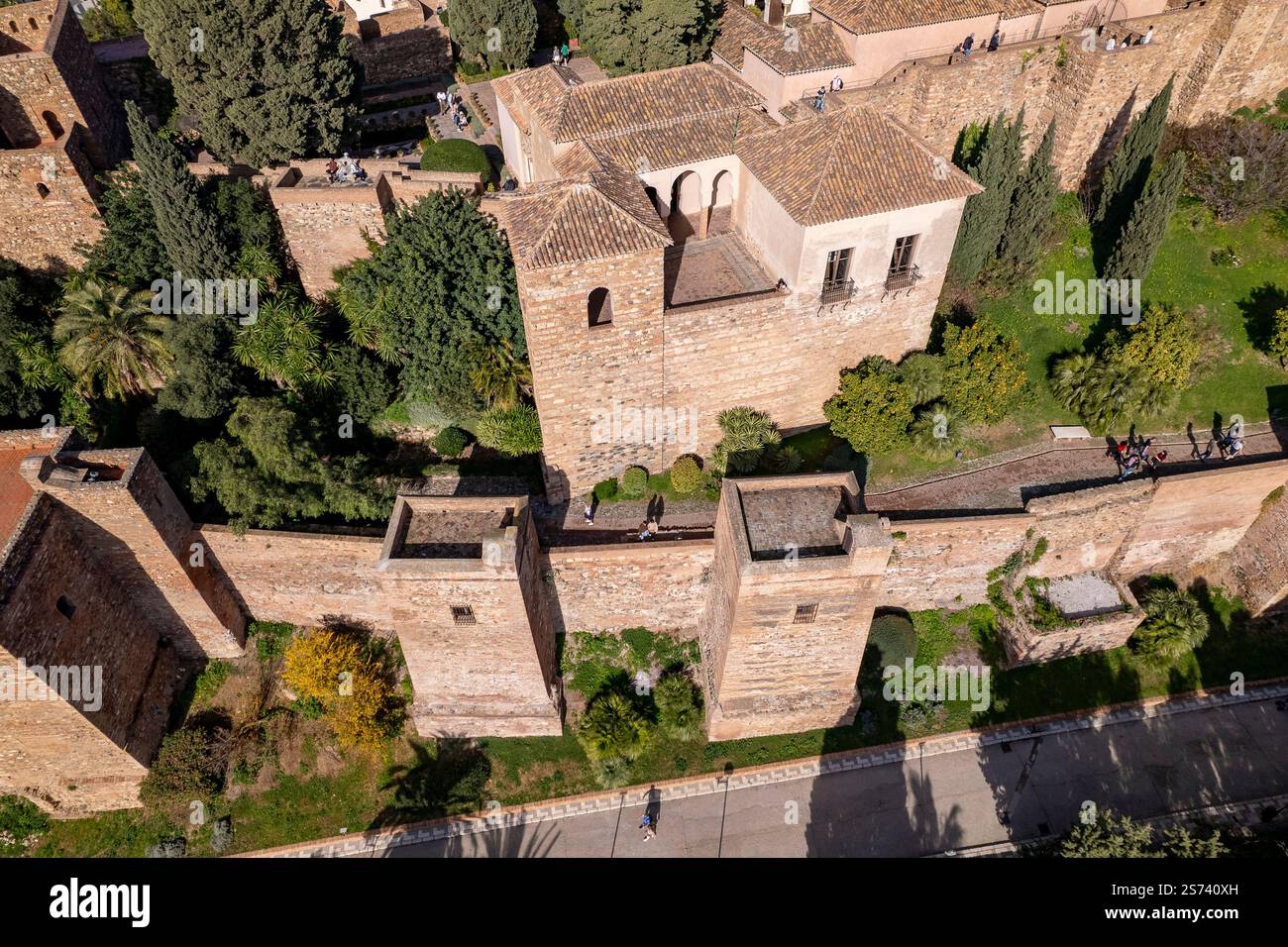 Architectural detail of La Alcazaba castle towers and palace gardens in ...