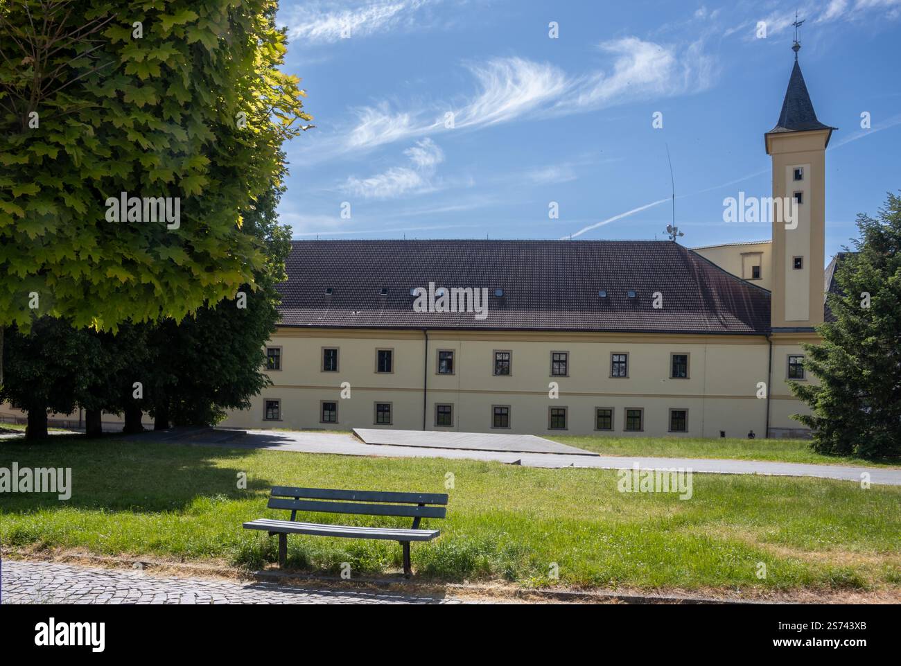 Building of a castle with a very long history. Tower with black roof ...