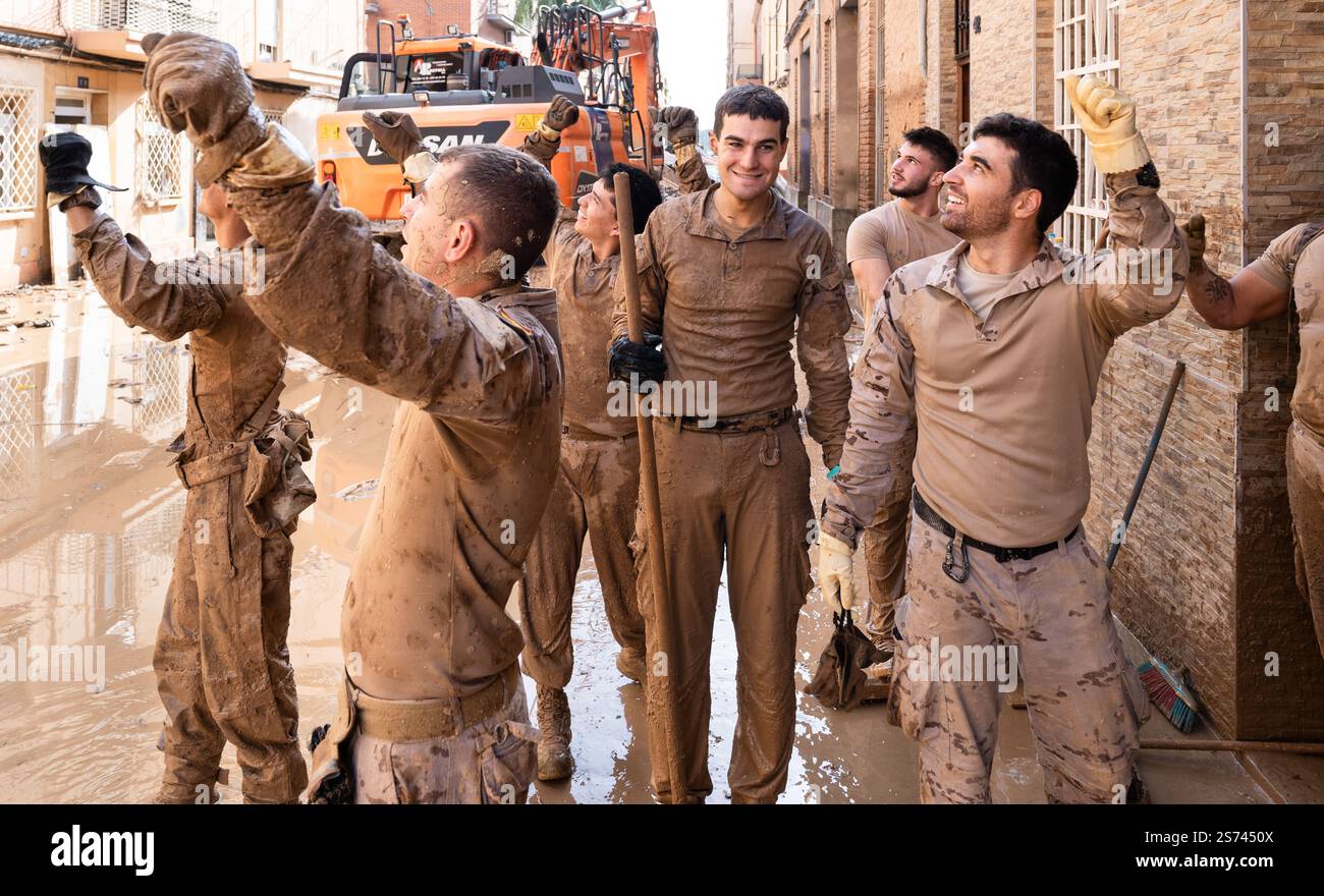 Joyful military celebration during cleanup operations in DANA affected areas. Brigada de ...