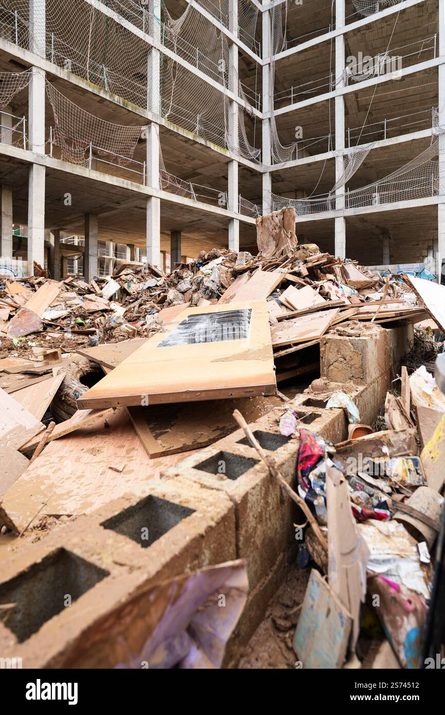Debris junkyard in front of an abandoned dangerous building after DANA ...