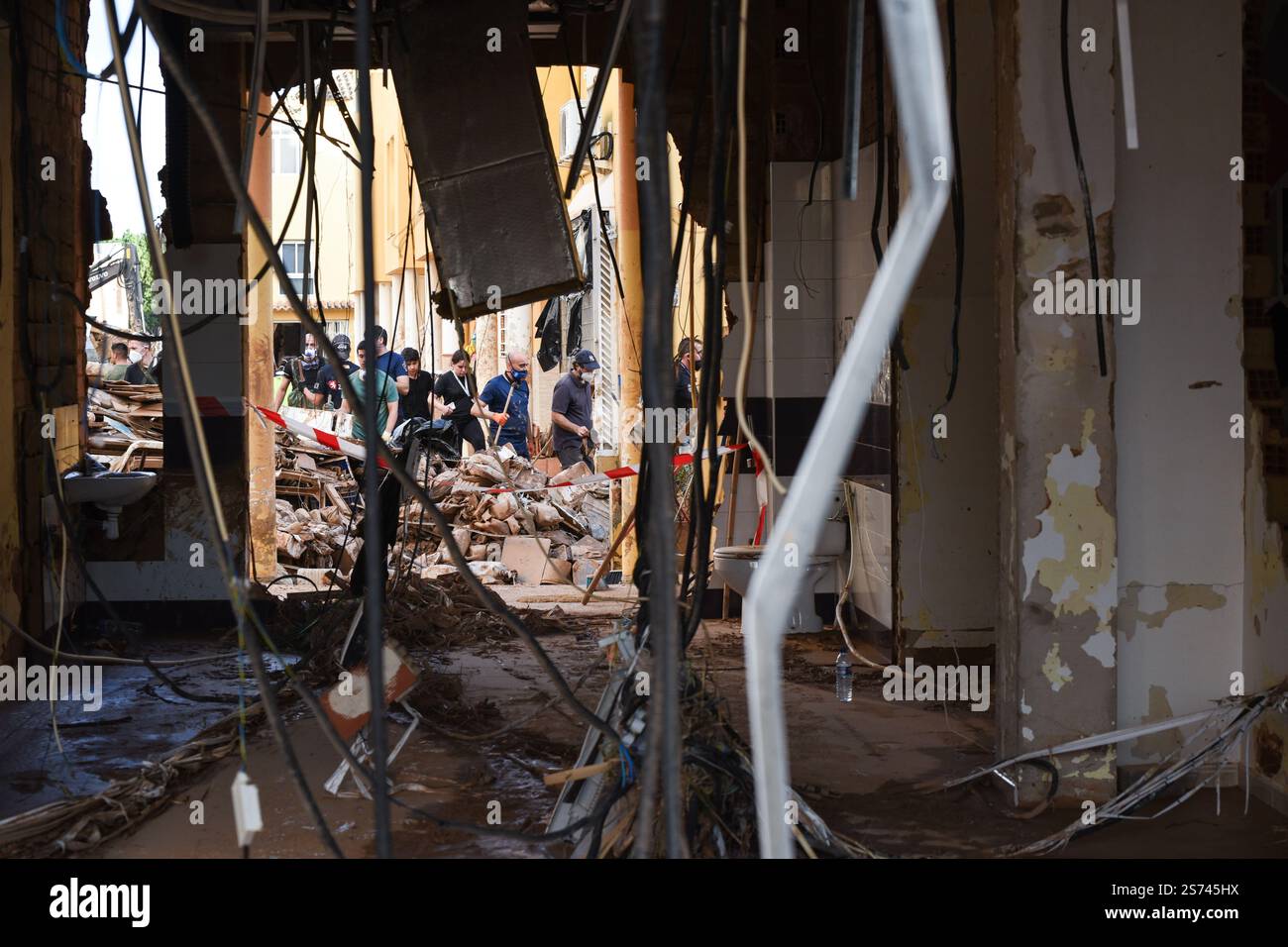 Destroyed building with fallen installations and cables mess after DANA ...