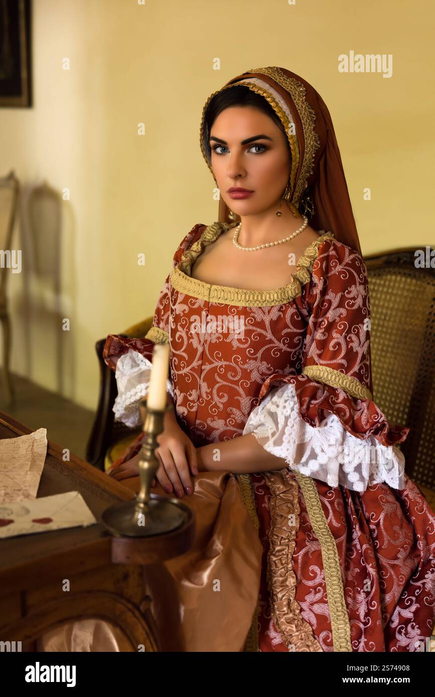 Closeup portrait of a lady in authentic renaissance dress and matching ...