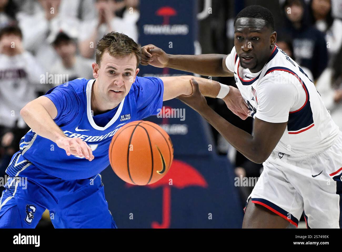 Creighton guard Steven Ashworth, left, and UConn guard Hassan Diarra ...