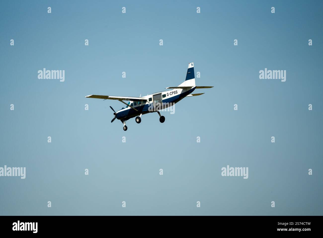 Cessna Grand Caravan G-CPSS light aircraft in flight, descending to ...
