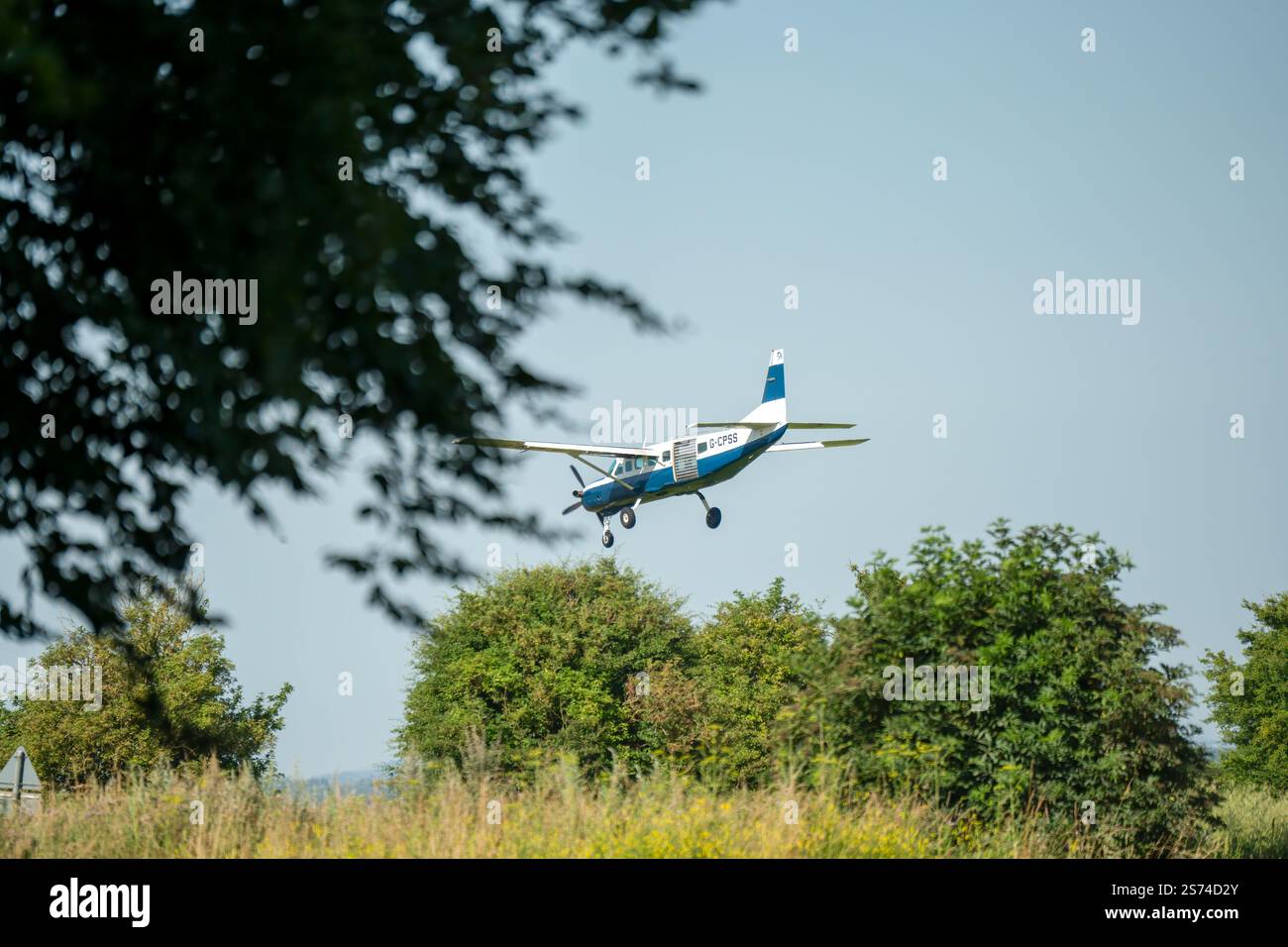 Cessna Grand Caravan G-CPSS light aircraft in flight, descending to ...
