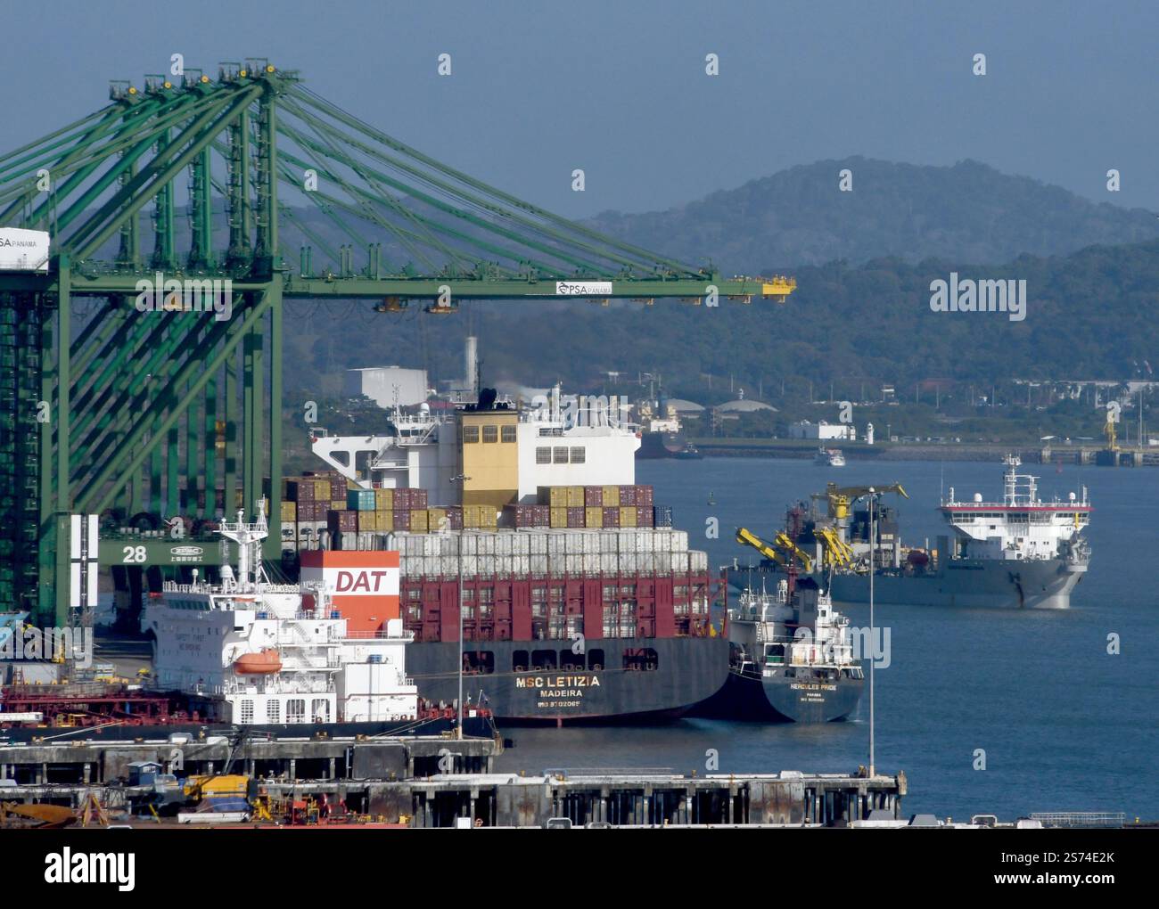 Balboa, USA. 12th Jan, 2025. Containers are loaded on and off ships at ...