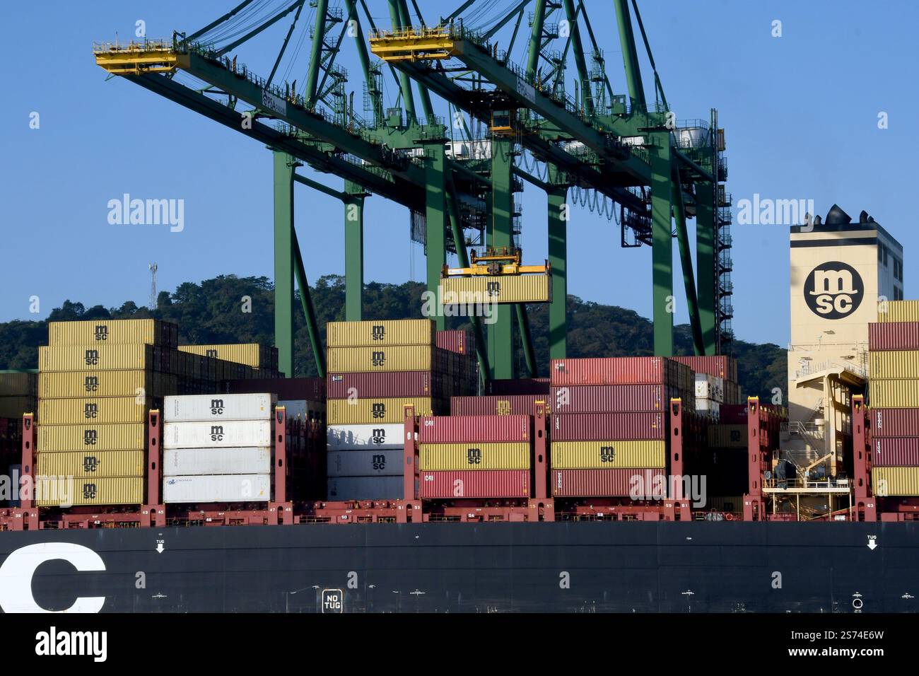 Balboa, USA. 13th Jan, 2025. Containers are loaded on and off ships at ...