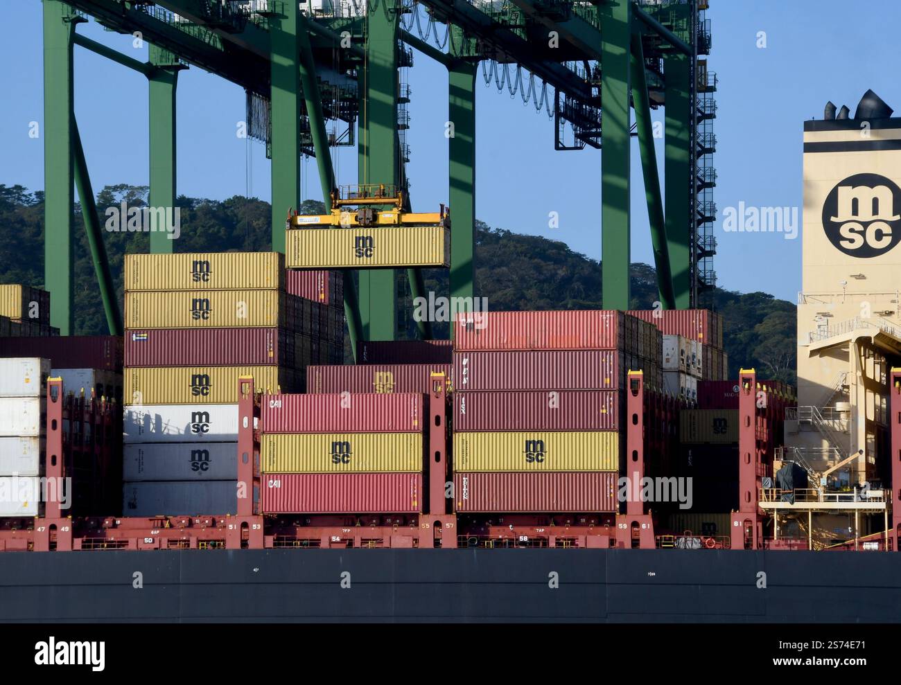 Balboa, USA. 13th Jan, 2025. Containers are loaded on and off ships at ...