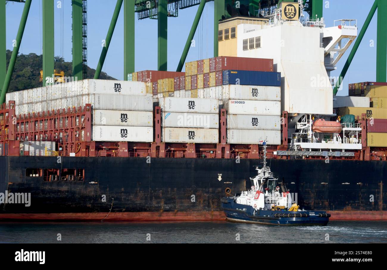 Balboa, USA. 13th Jan, 2025. Containers are loaded on and off ships at ...