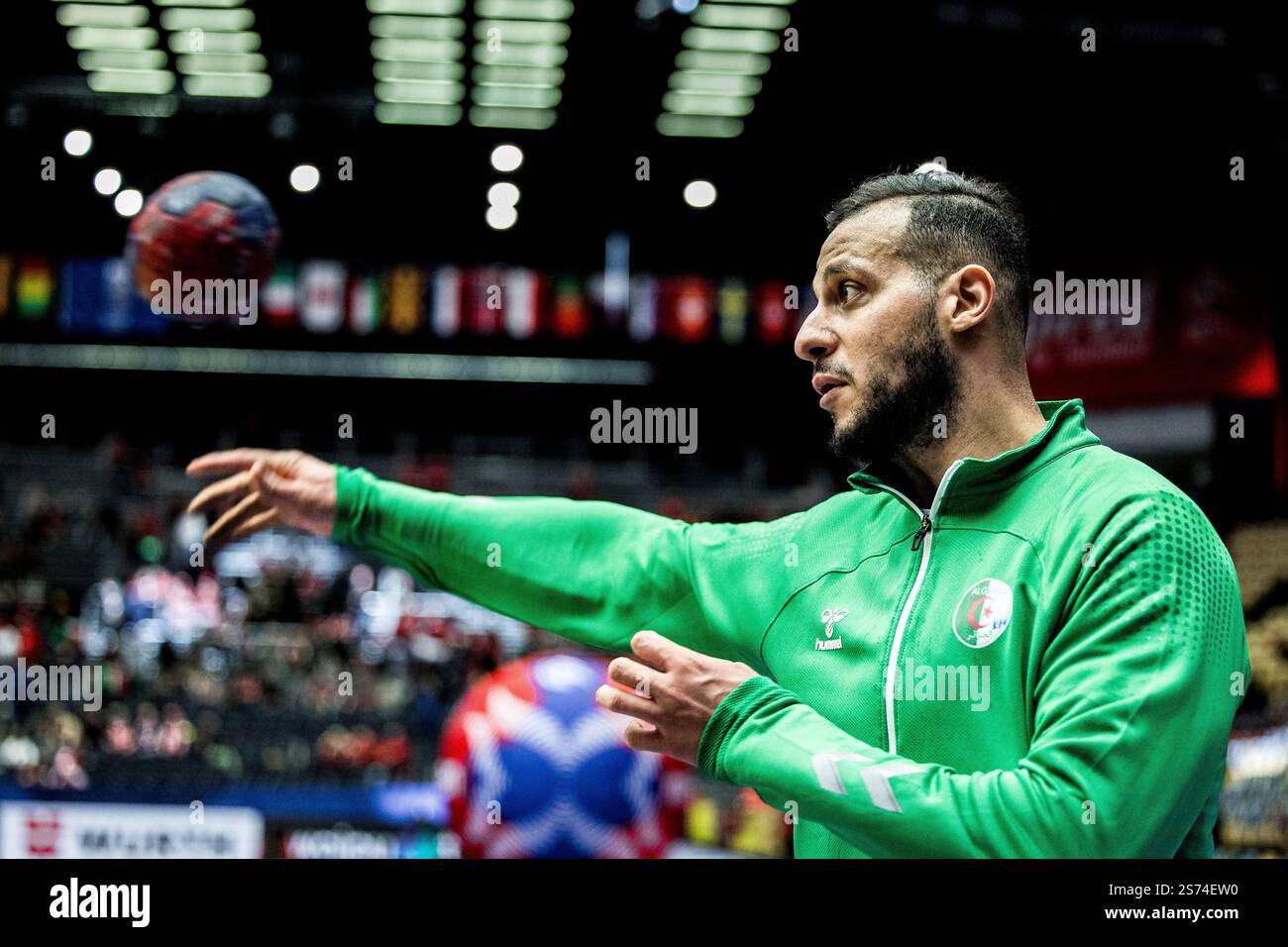 Herning, Denmark. 18th Jan, 2025. Ayoub Abdi (87) of Algeria is warming ...