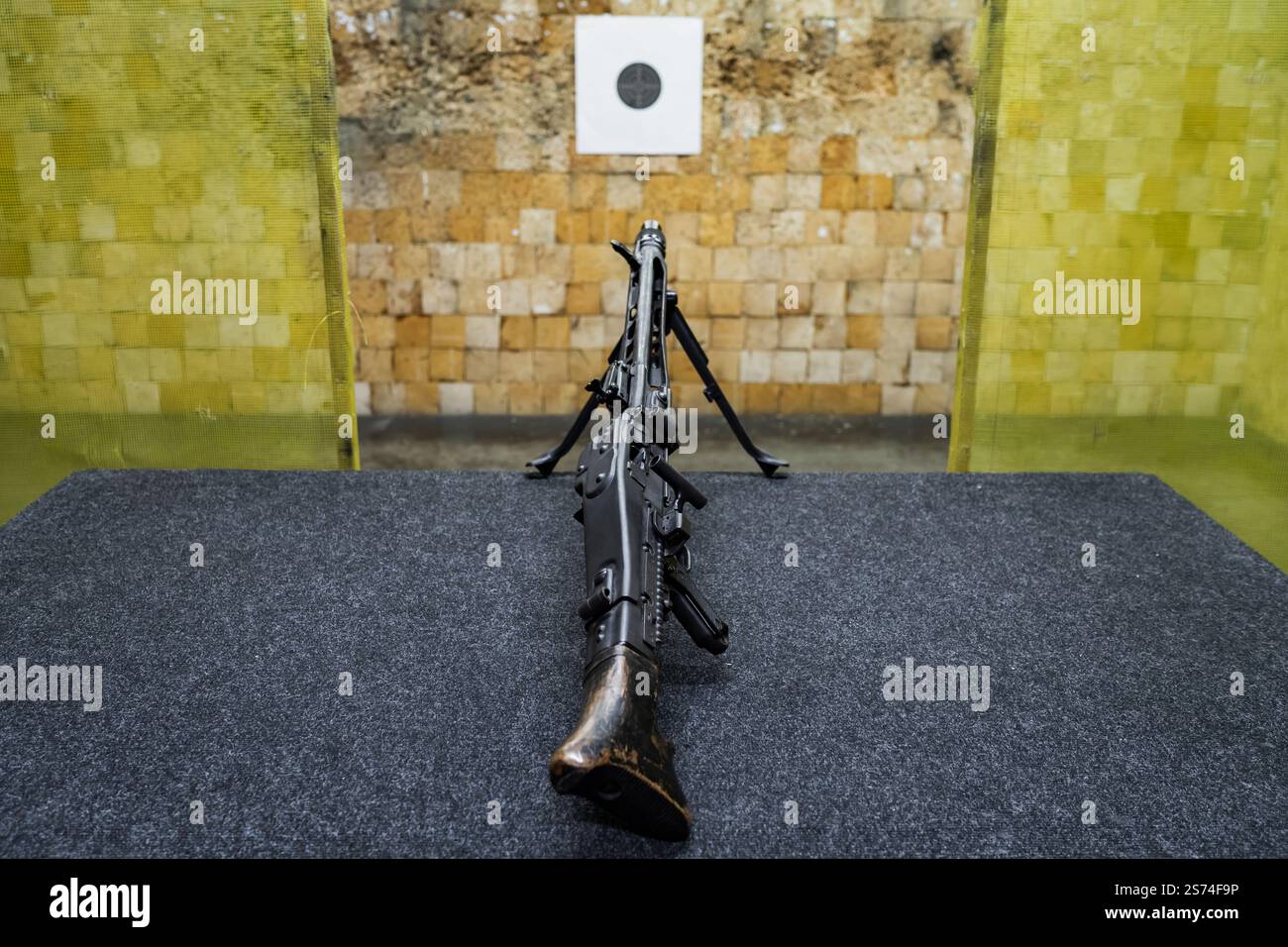 German machine gun on bipod is aimed towards the target at a shooting ...