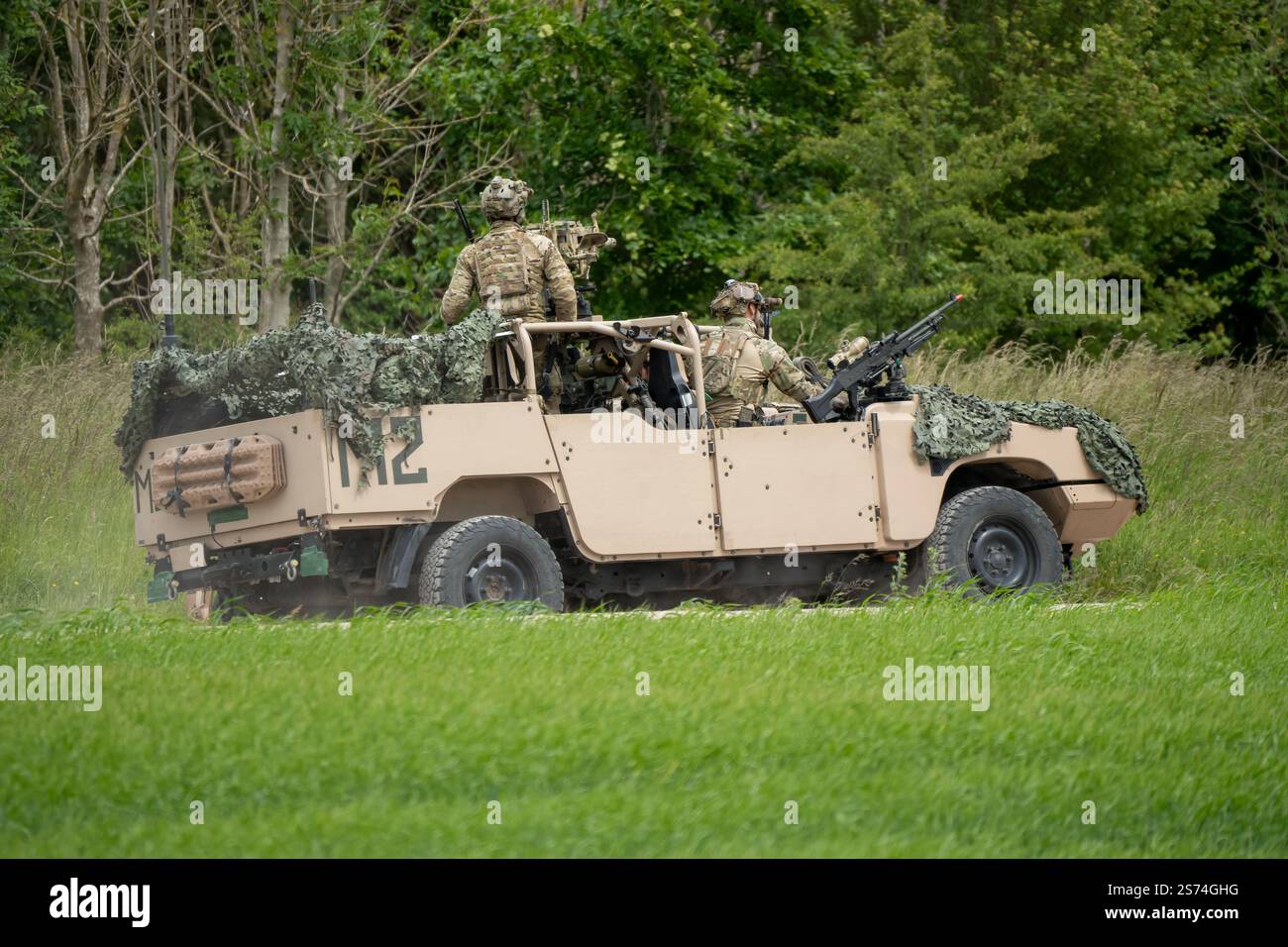 British army 4x4 utility vehicle in action Stock Photo - Alamy
