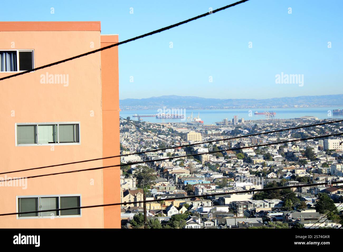 Cityscape Overlooking Bay with Power Lines and Industrial Harbor Stock ...