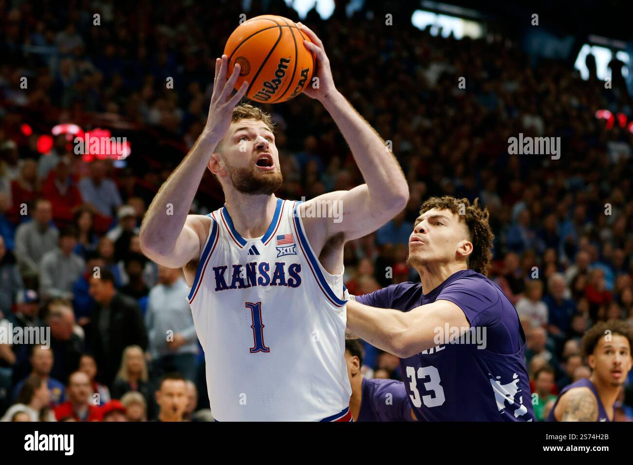 Kansas center Hunter Dickinson (1) attempts to score as Kansas State ...
