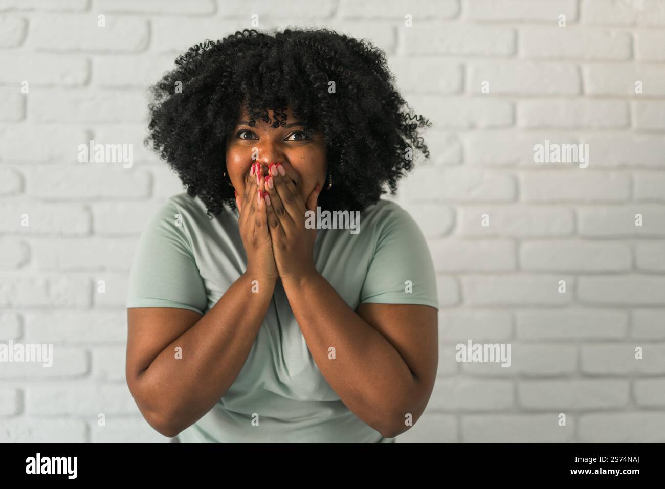 African American woman expressing pure joy with an enthusiastic and ...