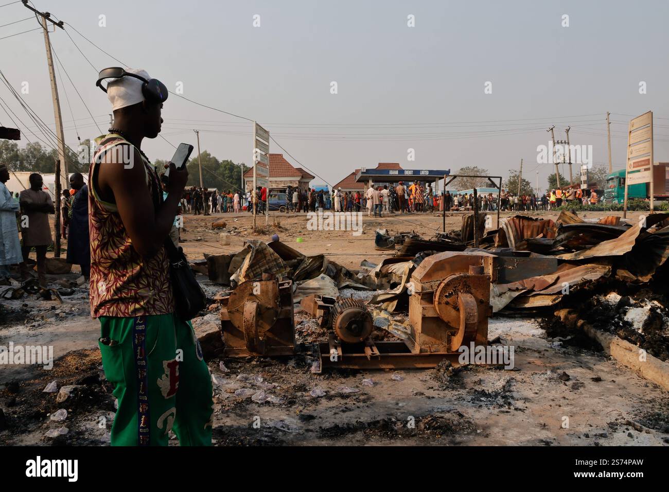Fuel tanker explosion kills 70 in Nigeria A man looks at the scene ...