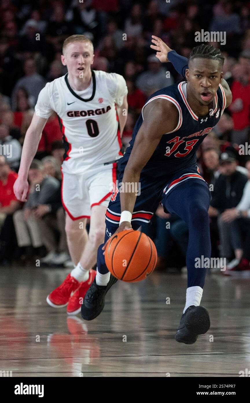 Auburn guard Miles Kelly (13) dribbles the ball ahead of Georgia guard ...
