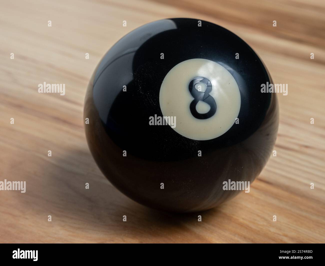 A classic black eight ball from a pool billiards set isolated on a ...