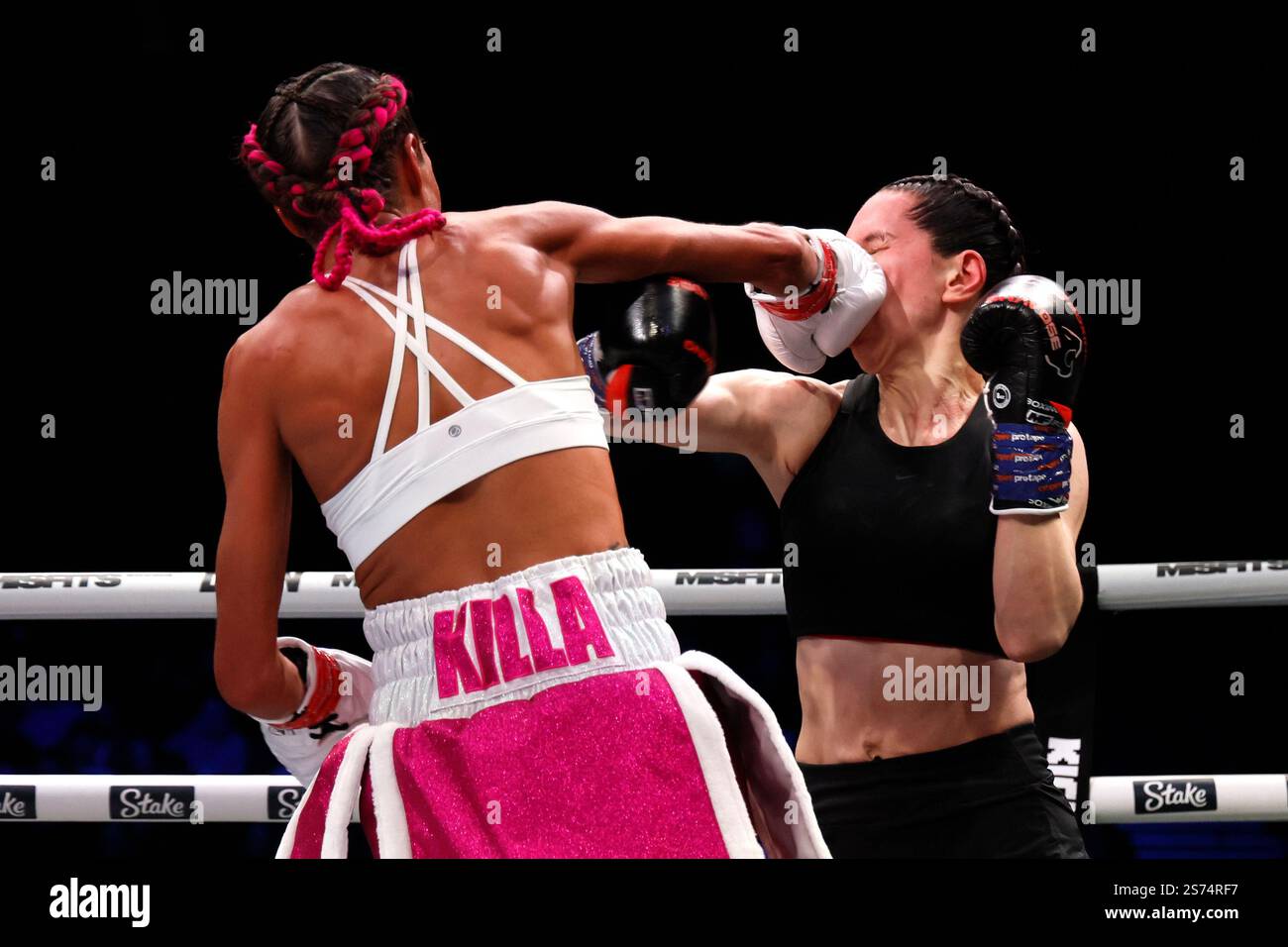 Carla Jade (left) strikes Melanie Shah in the Misfit Light Title bout ...