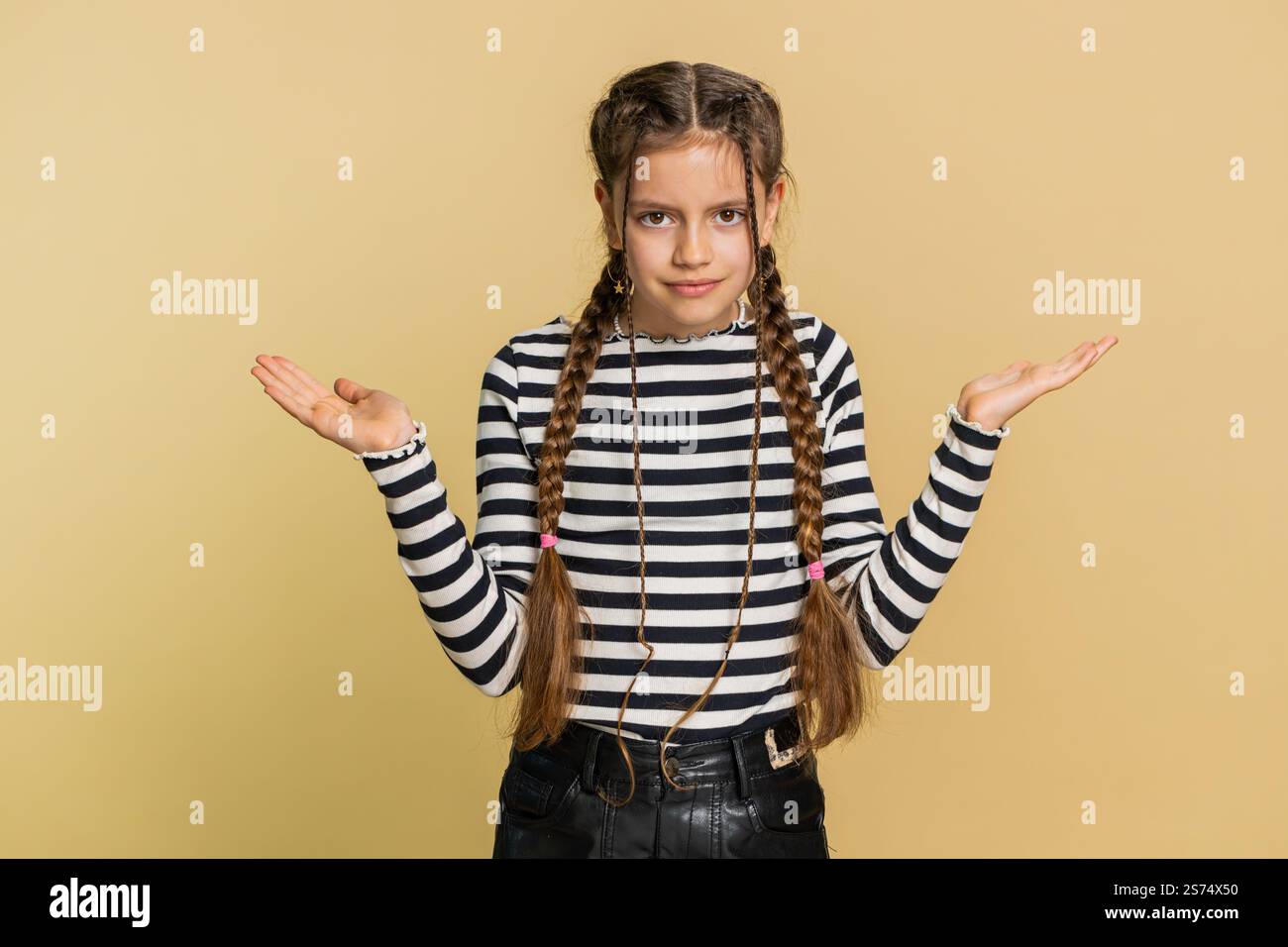 What. Why. Young school girl raising hands in indignant expression ...