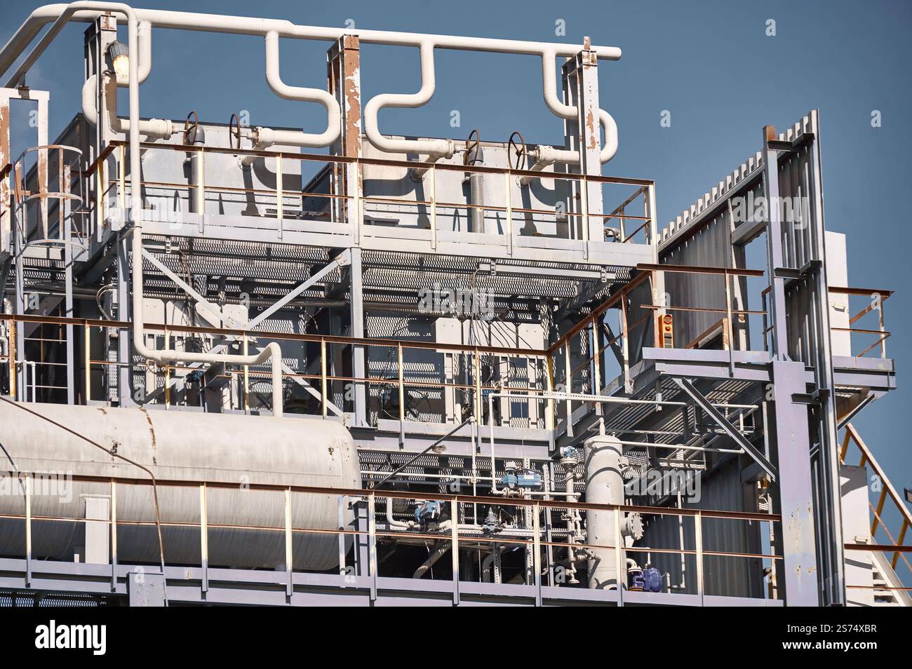 Detailed view of a chemical plant structure during daytime operations ...