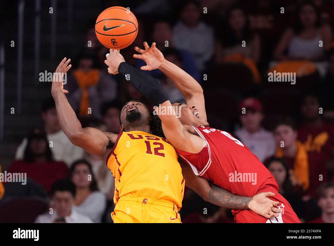 Southern California forward Rashaun Agee, left, and Wisconsin guard ...