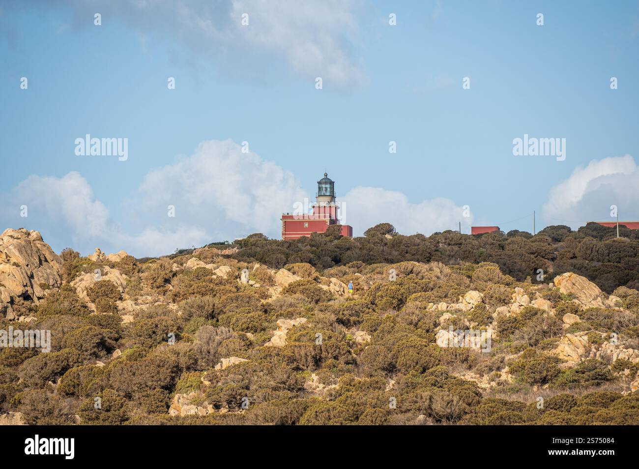 The beautiful red lighthouse of Capo Spargivento in southern Sardinia ...
