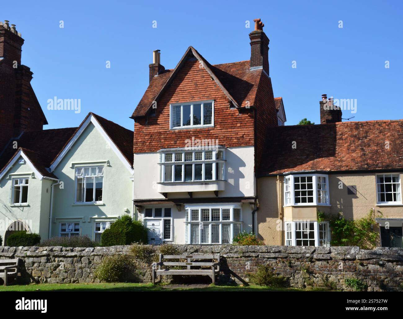 House with an interesting exterior design with clay tile hung cladding ...