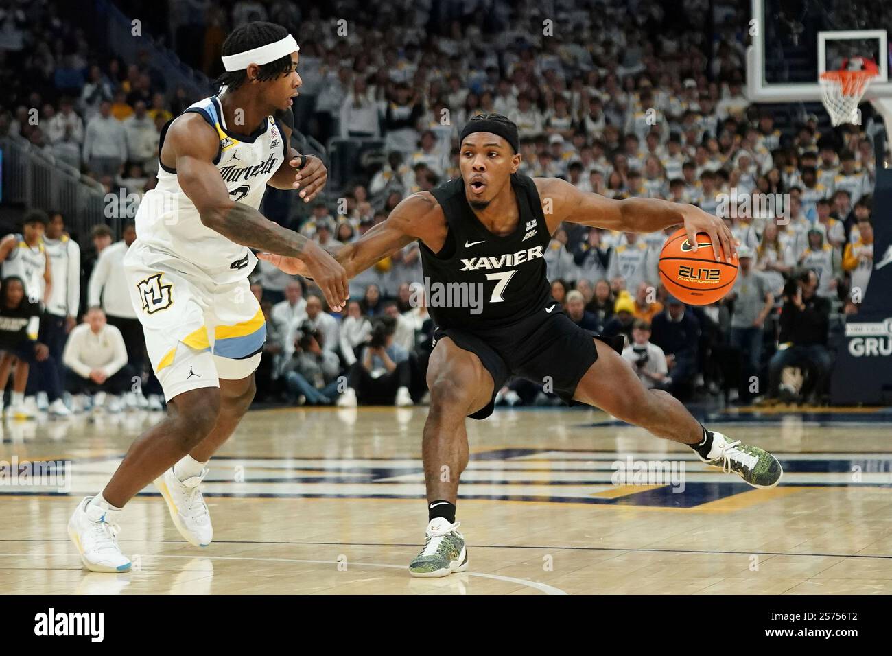 Xavier's Ryan Conwell (7) dribbles against Marquette's Chase Ross ...