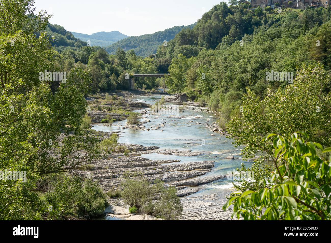 blue-white water cascading over rocks, waterfall in a Spanish Pyrenees ...