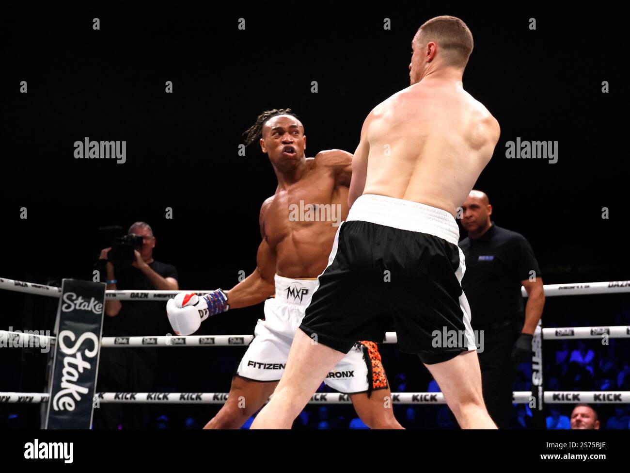 Moziah Pinder (left) in action against Wade Plemons in the light ...