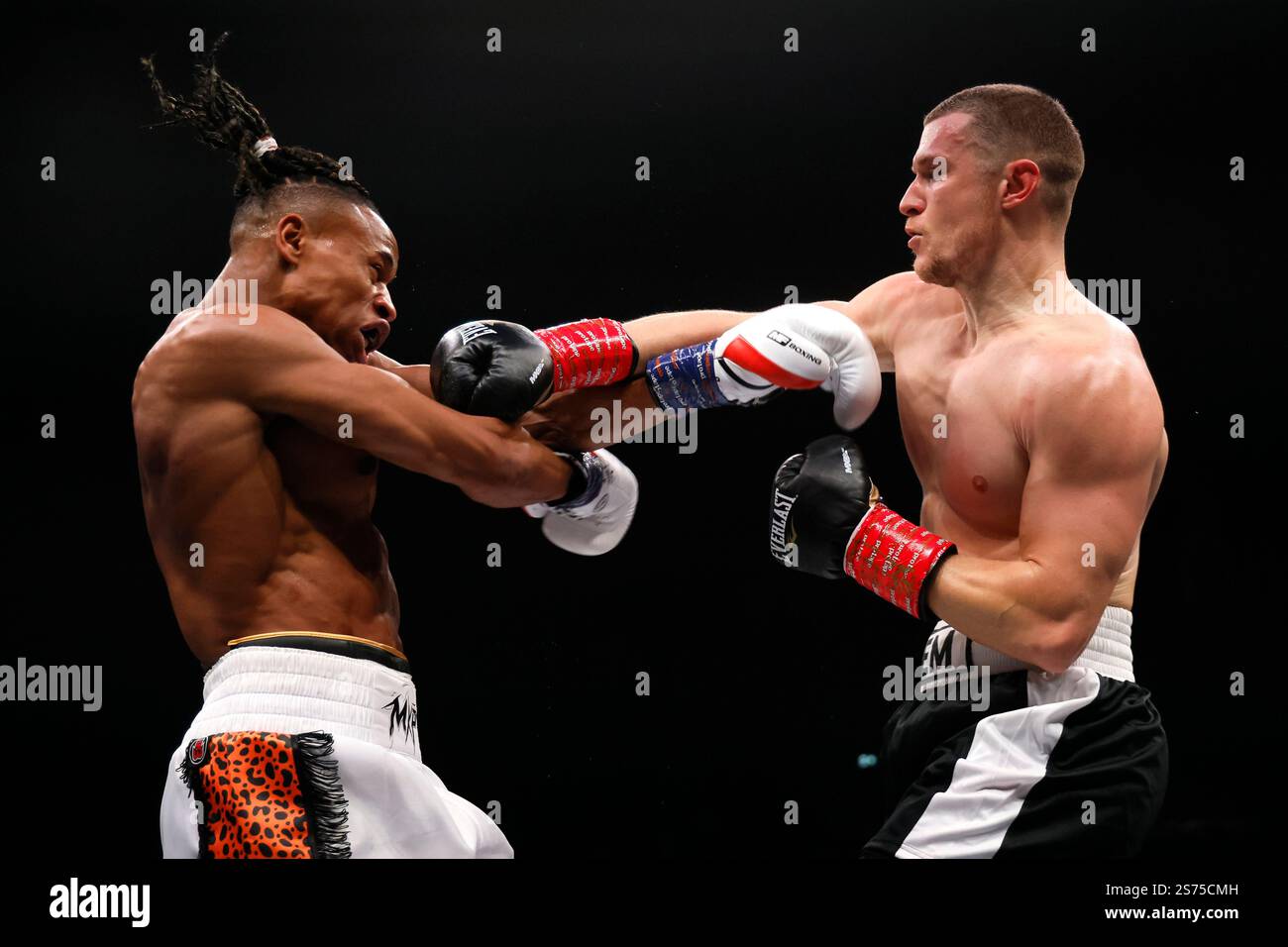 Wade Plemons (right) in action against Moziah Pinder in the light ...
